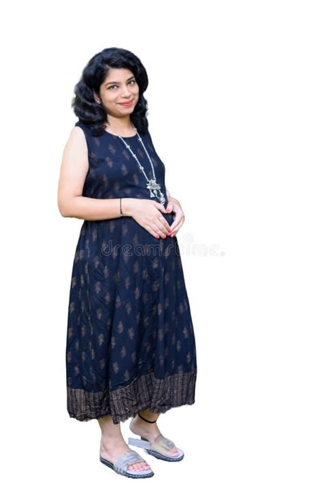 A Pregnant Indian Lady Poses For Outdoor Pregnancy Shoot And Hands On