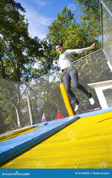 Woman In Mid Air On Trampoline Stock Photo Image Of Jump Outdoors