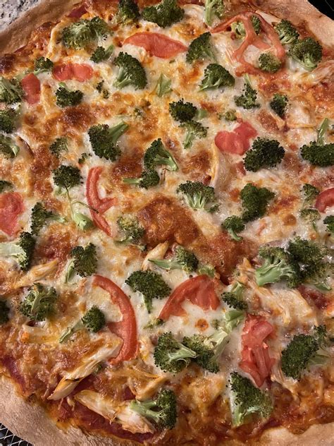 Thin Crust Pizza With Garlic Chicken Tomatoes And Broccoli All From