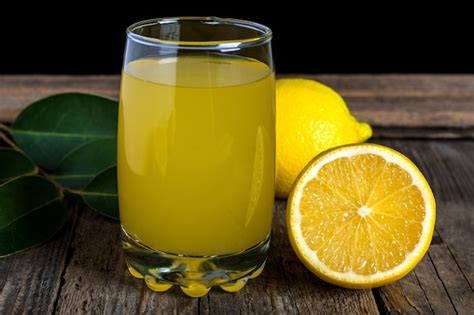 Premium Photo | Squeezing lemon juice with hand juicer