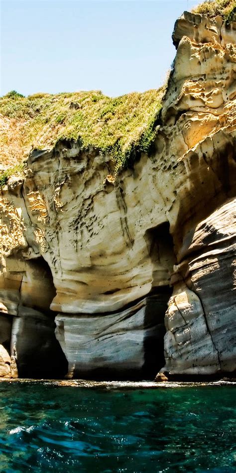 Завантажити шпалери на робочий стіл ПК Скеля Земля Печера Океан