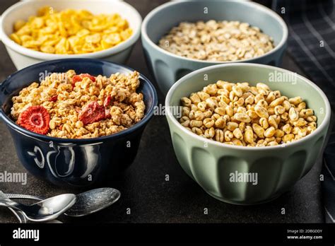 Various Breakfast Cereals In Bowls Puffed Wheat And Oatmeals Stock