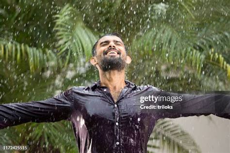 Man Standing On Water With Arms Up Photos And Premium High Res Pictures