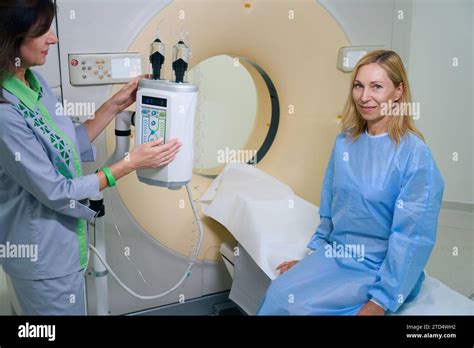 Radiographer Involved In Preparation Of Female Patient For Contrast Enhanced CT Stock Photo Alamy