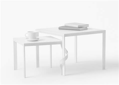 nendo s tangle side tables twine together as if holding hands