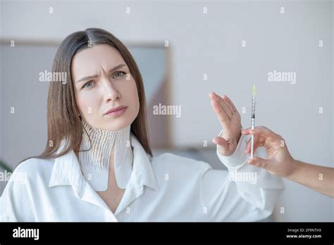 Young Beautiful Woman Visiting Beauty Center And Rejectong Botox