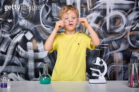 Scientist wipes his glasses after conducting dangerous experiment in laboratory 이미지 1393247470