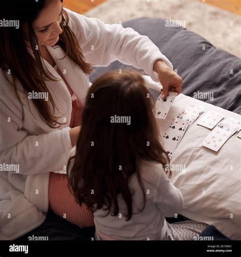 Lazy Morning With Mom A Mother And Daughter Playing Cards While Sitting In Bed Stock Photo Alamy