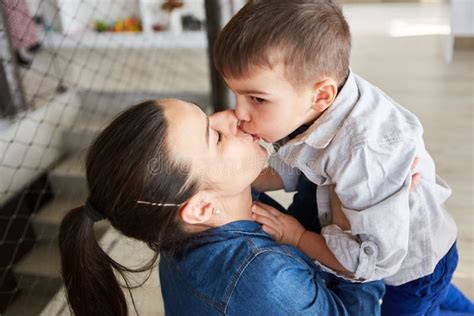 Mother And Son Give Each Other A Loving Kiss Stock Photo Image Of Togetherness Maternity