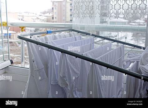 Drying Clothes On The Balcony In Winter White Clothes Drying On The Clothes Hanger Drying The