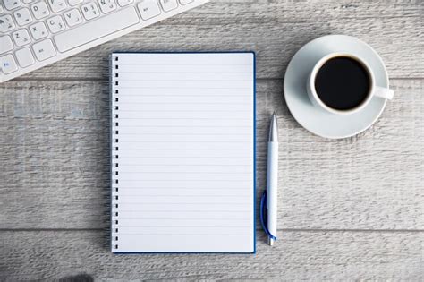 Premium Photo Notepad With Keyboard On Table