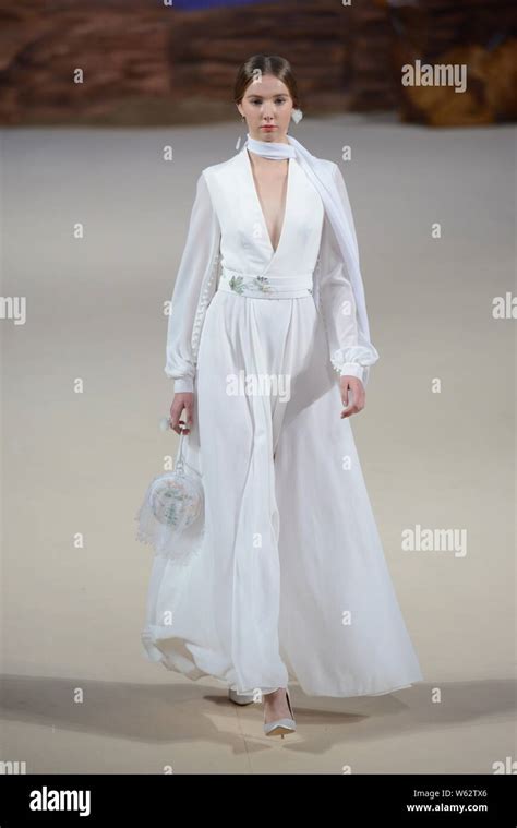A Model Displays A New Creation At The Fashion Show Of Heaven Gaia By