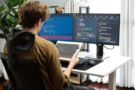 It Developer Reading Coding On Document Paper Software With Screens Gusher Foto De Stock Y Más