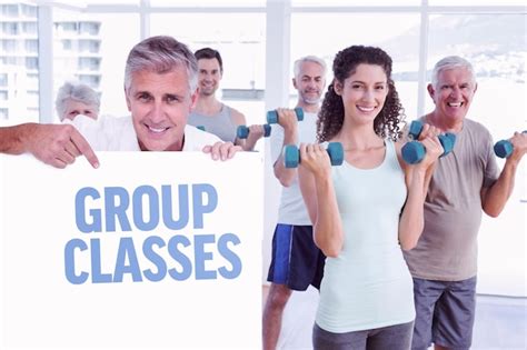 Premium Photo Casual Man Showing A Poster Against Group Classes