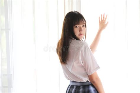 Portrait Japanese School Girl Uniform In White Tone Bed Room Stock