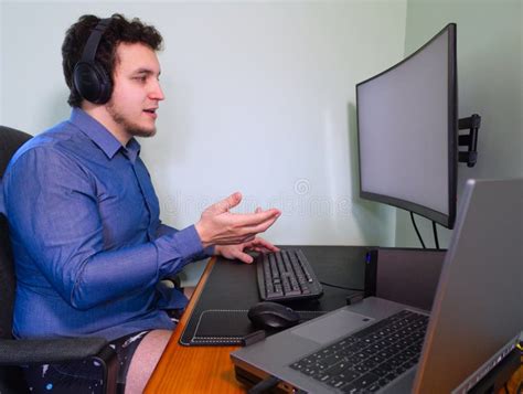Young Caucasian Programer Man In Underwear Talking With His Coworkers By Teleconference Stock