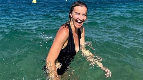 Helen Skelton Looks Radiant As She Splashes About In A Plunging Black