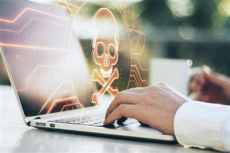 Premium Photo Close Up Of Male Hands Using Laptop On Tablet With Coffee Cup And Digital Skull