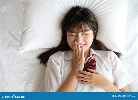 Portrait Japanese School Girl Uniform Sleep And Look At Camera In White