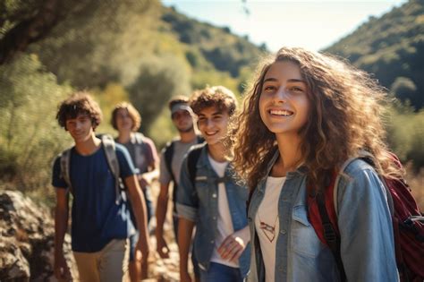 Premium Photo A Group Of Teenagers Hiking And Enjoying Nature
