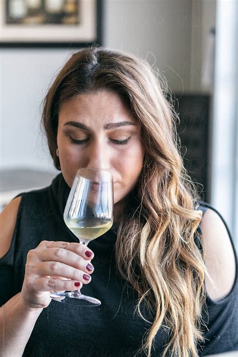 Woman Sniffs Wine Bouquet By Stocksy Contributor Sean Locke Stocksy