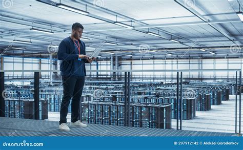 data center engineer using laptop computer server farm cloud computing