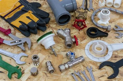 Premium Photo Plumbing Tools Pipeline Components And Gloves On The