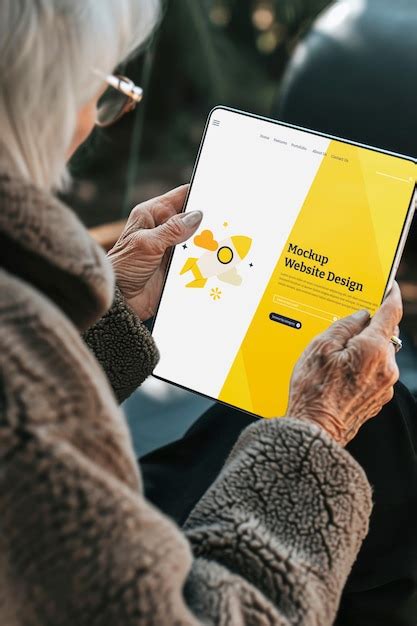 Premium Psd Old Person Using Digital Device Mockup