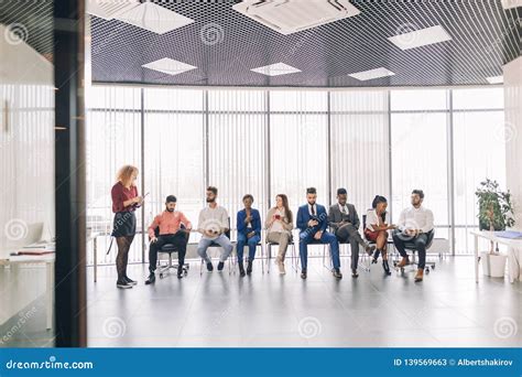 Young Red Haired Girl Is Running The Experiment Among Young People