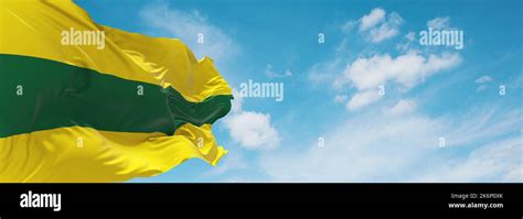 Official Flag Of Isabela Untied States Of America At Cloudy Sky Background On Sunset Panoramic