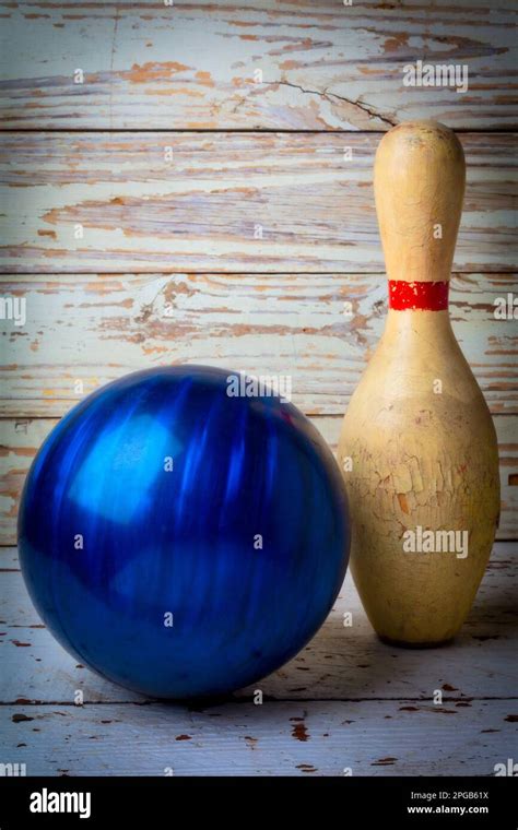 Old Blue Bowling Ball And Weathered Worn Bowling Pin Still Life Stock