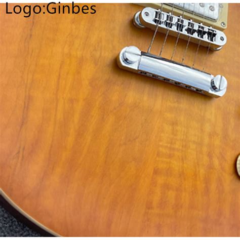 Electric Guitar Solid Flame Maple Board Satin Finisehd Oragne Top One Piecemahogany Body And