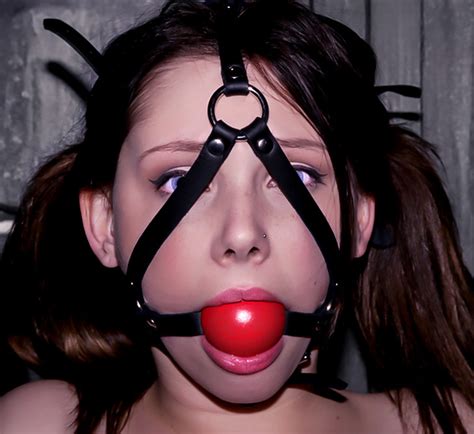 Bright Eyed Teen With Pig Tails Silenced By A Huge Red Ballgag Thats
