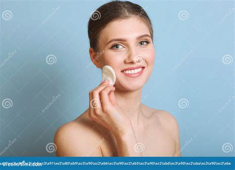 Beautiful Young Girl With Nude Makeup Removes Makeup With A Cotton Pad