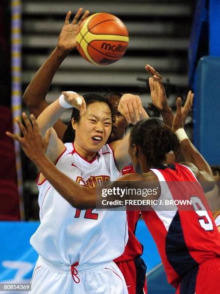 Chinas Chen Xiaoli Passes The Ball Under Pressure From The Usas