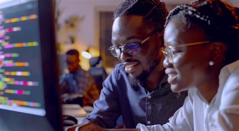 Premium Photo Happy Male And Female Software Developers Collaborating On Project In Modern Office