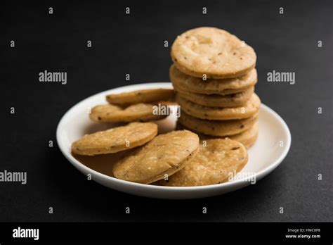 Spicy Fried Mathri Or Mathari Which Is An Indian Snack Served With A Cup Of Tea Selective Focus