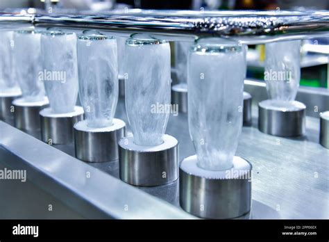 Cleaning Bottles Glass Bottles For Beverage Product In Process By Hot Water In Automatic Machine