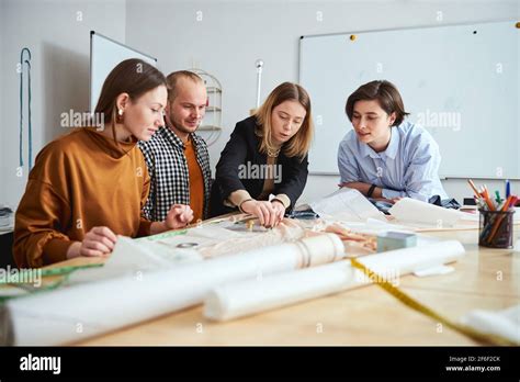 Measuring The Length On The Clothes Pattern In Modern Studio Stock Photo Alamy