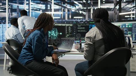 Data Center Engineer Using Tablet To Interpret Ai Generated Data