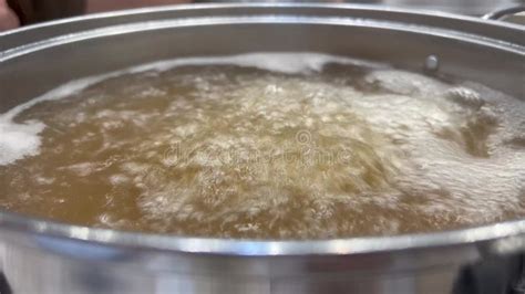 Video Of Pot With Boiling Water With Bubbles Close Up On Black Kitchen