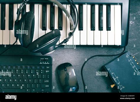 Keyboard Or Synthesizer With Headphones And Sound Card Computer