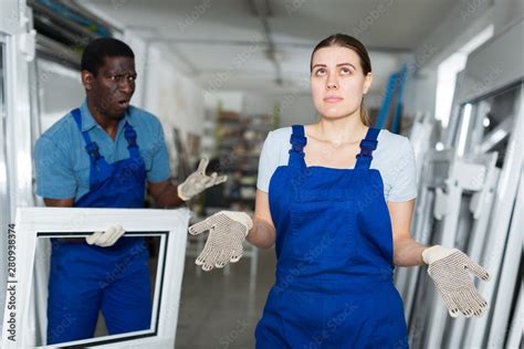 Adult Masters Are Holding Modern Window Frames And Conflicting Stock Photo Adobe Stock