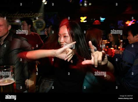 Shanghai China Young Women Enjoying Themselves In One Of The Bars Along