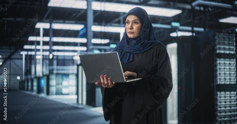 Muslim Female Data Center IT Engineer Standing In A Room With Server Racks Cloud Computing