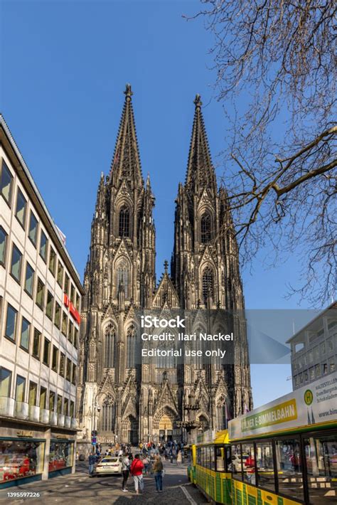 Cologne Cathedral Twin Towers Rising Above City Skyline On A Bright
