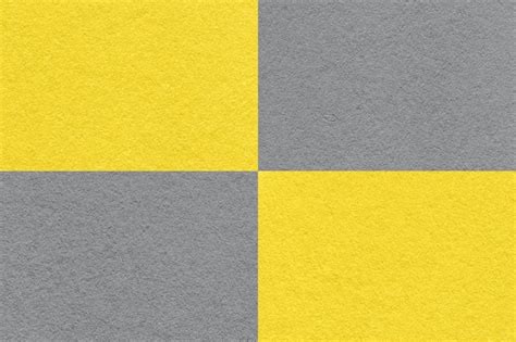 빈티지 회색 판지의 셀 패턴 매크로 구조와 공예 회색 및 노란색 종이 배경 질감 프리미엄 사진