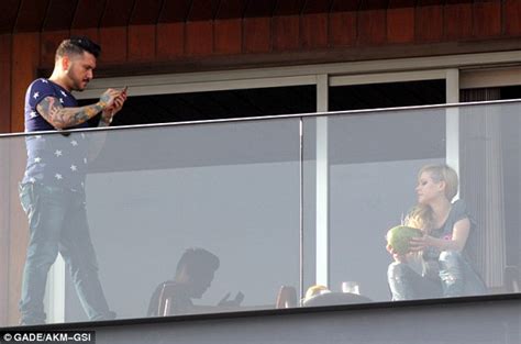 Avril Lavigne Lands In Rio For A Concert AND Some Coconut Juice At The Same Luxury Hotel Where