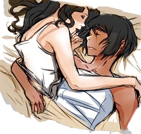 Two People Hugging On A Bed