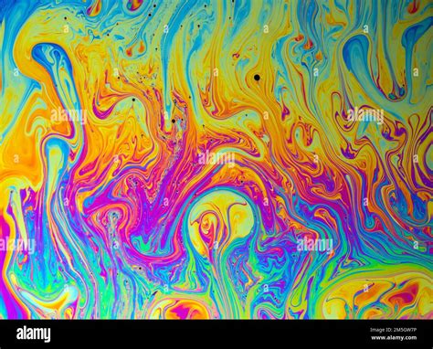 Colourful Light Diffraction Patterns Formed By Oil Droplets Floating On